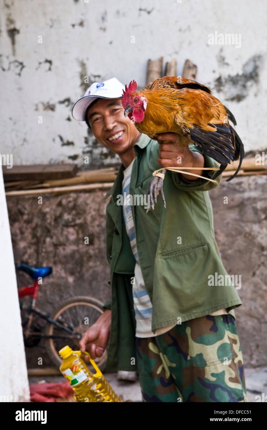 Man with a rooster hi-res stock photography and images - Alamy