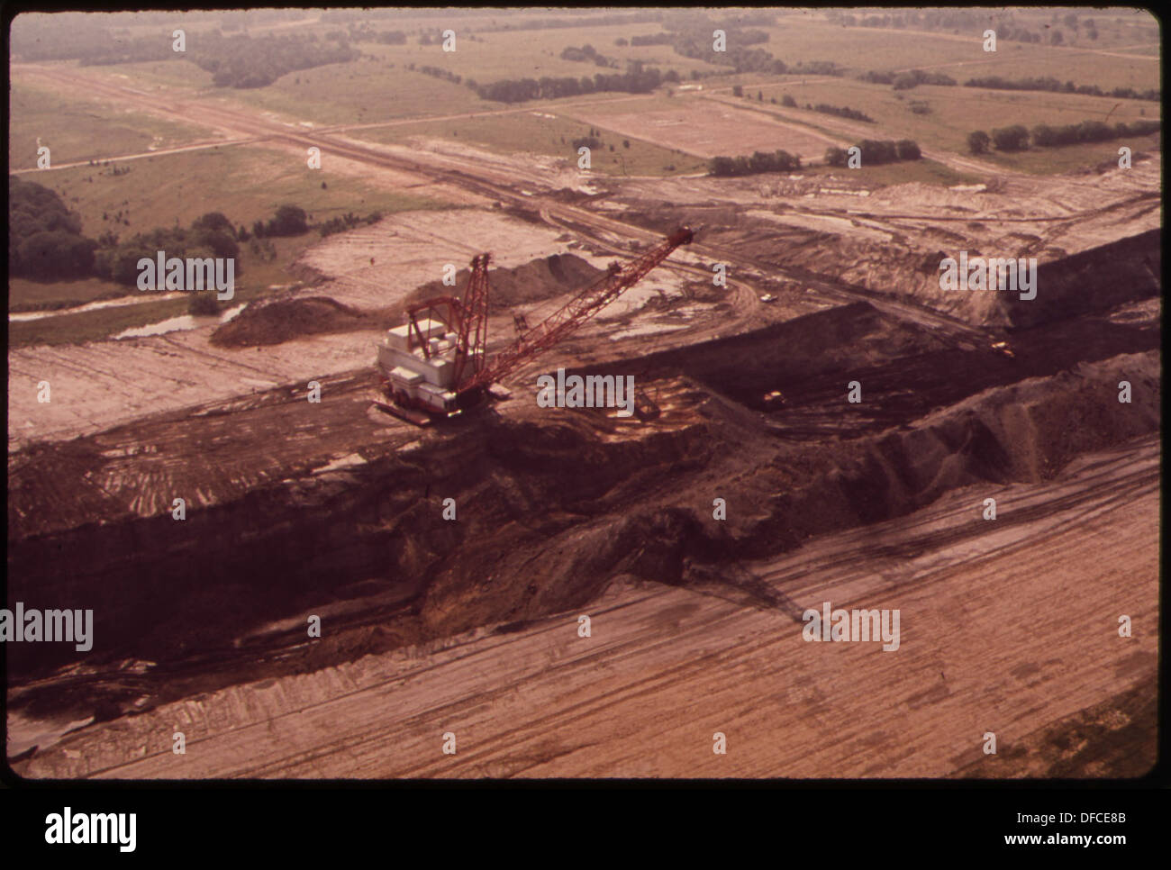 This photograph depicts the Big Brown coal mining operation. The image ...