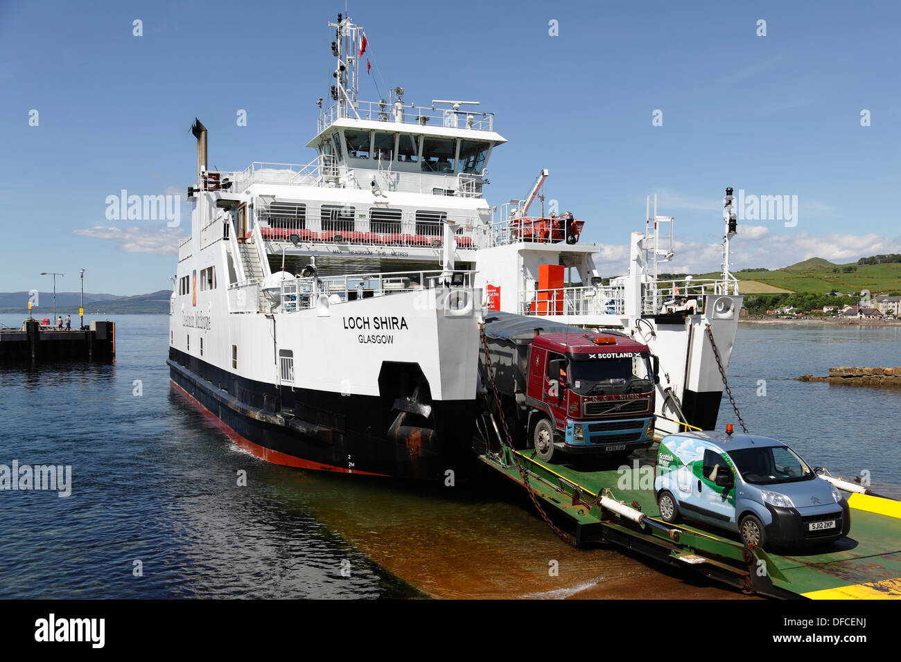 Vehicles drive off a Calmac Ferry on the slipway after sailing to Largs ...