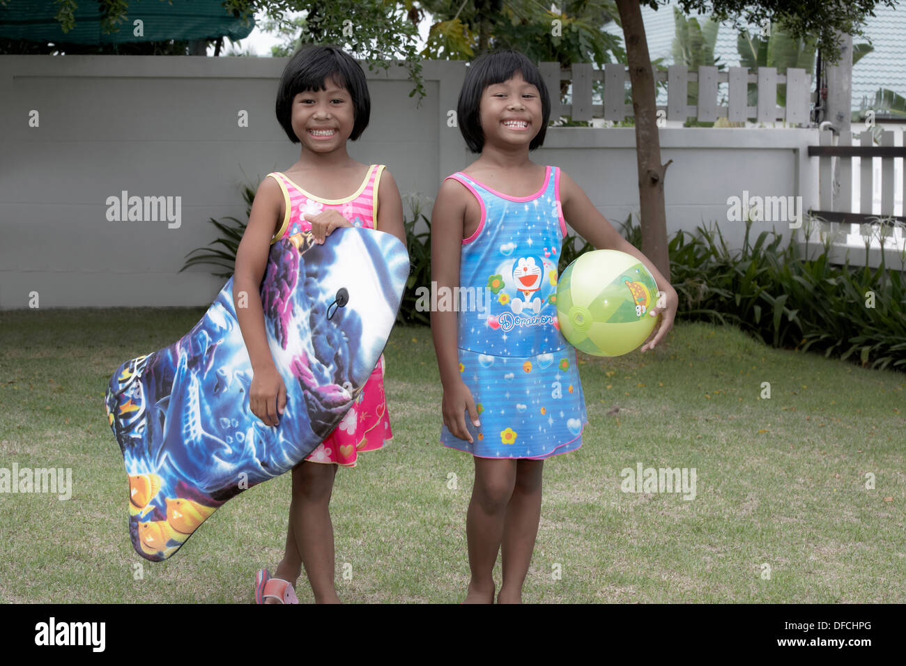 Twins. Identical twin Thai 6 year old sisters. Thailand children S. E ...