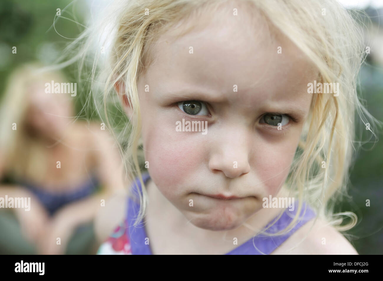 Portrait of girl biting lip hi-res stock photography and images - Alamy