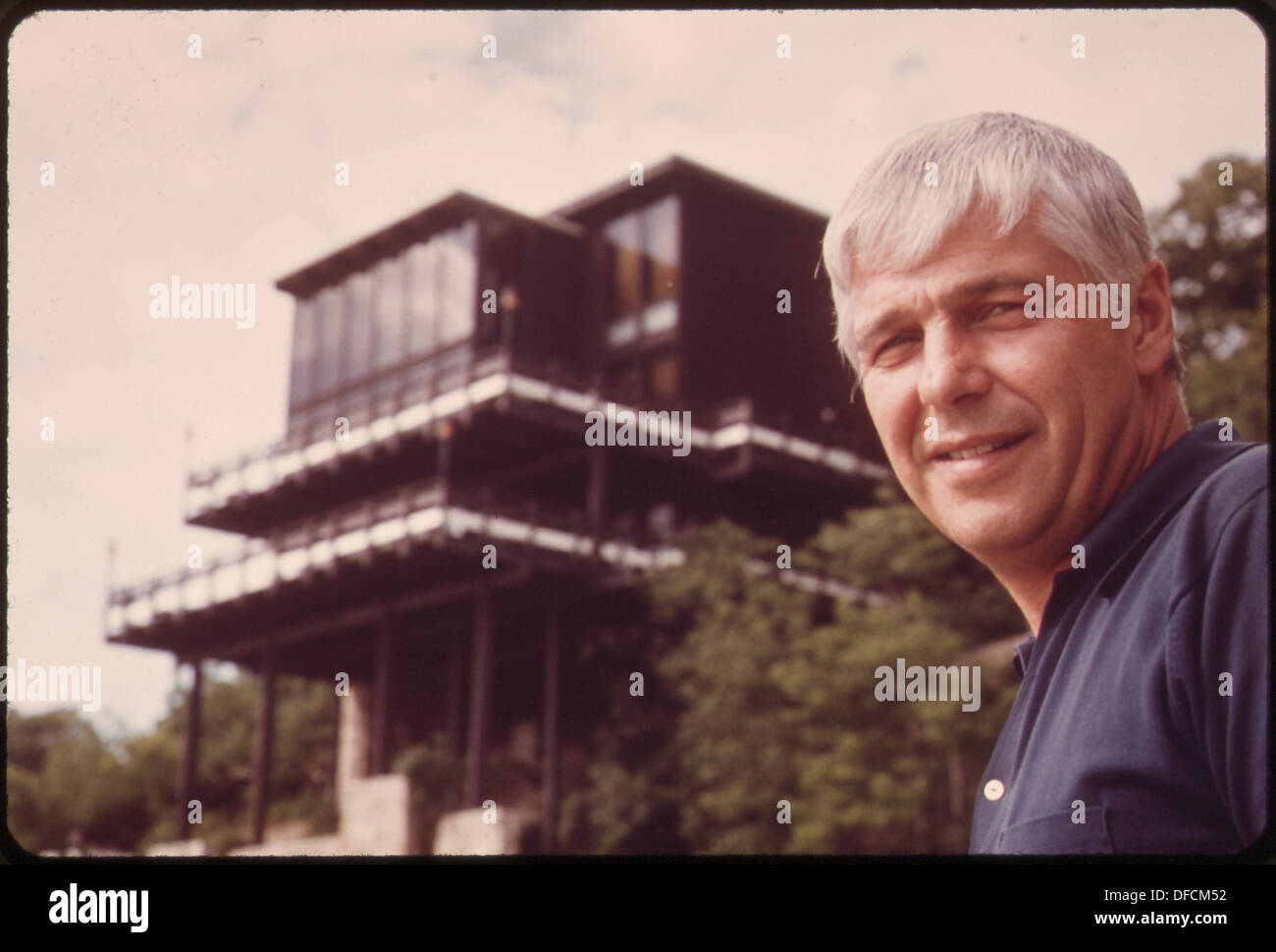 CHARLES WELEK, REALTOR, POSES IN FRONT OF A $75,000 VACATION HOME, PART ...