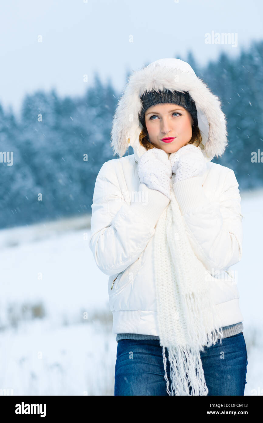 Winter, woman with warm outfit poses on outdoor, vertical format Stock ...