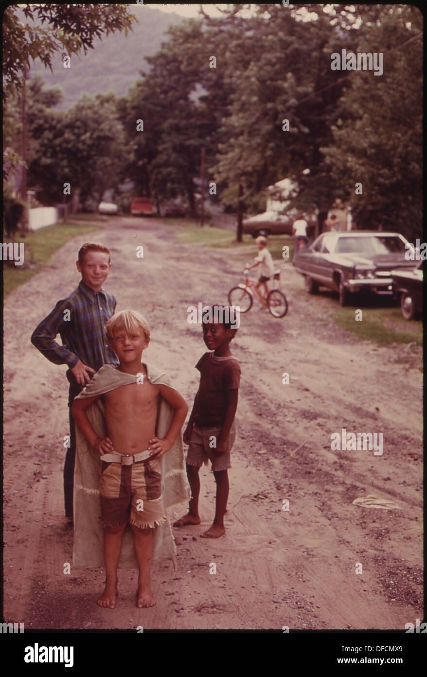 This image captures children playing in an unpaved street in Rand ...