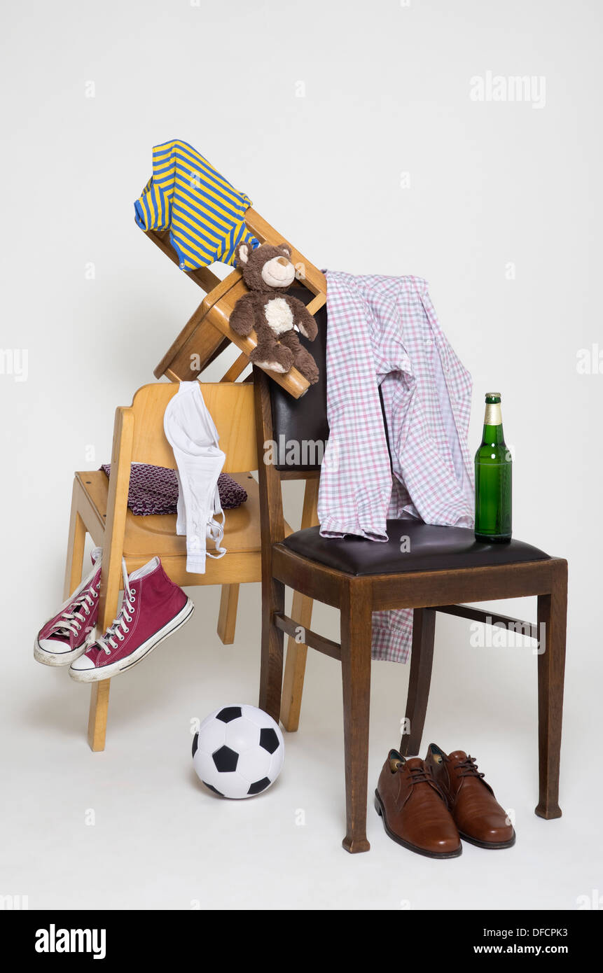Clothes on a chair Cut Out Stock Images & Pictures - Alamy