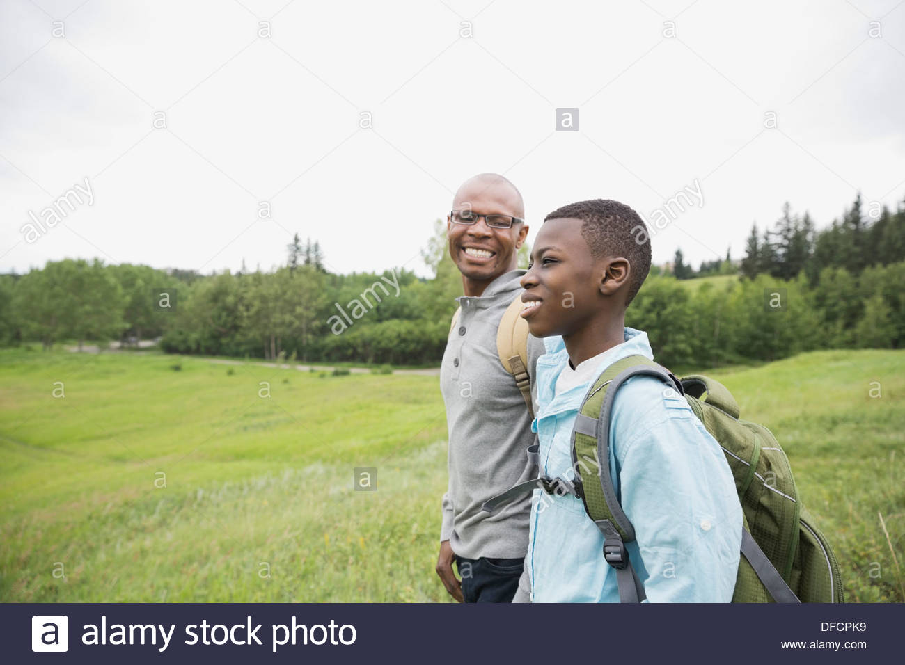 Father Son Standing Side Side Stock Photos & Father Son Standing Side ...