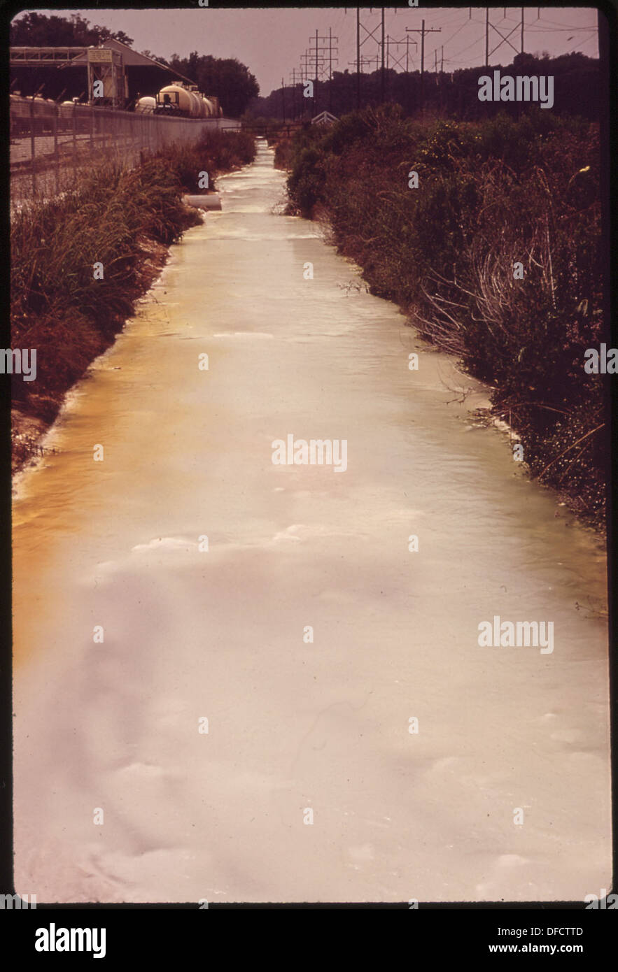 This photograph shows contaminated water in a drainage ditch located ...