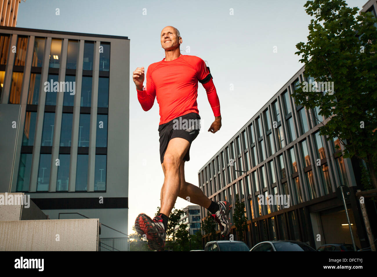 Mature athletic man running on stairs hi-res stock photography and ...