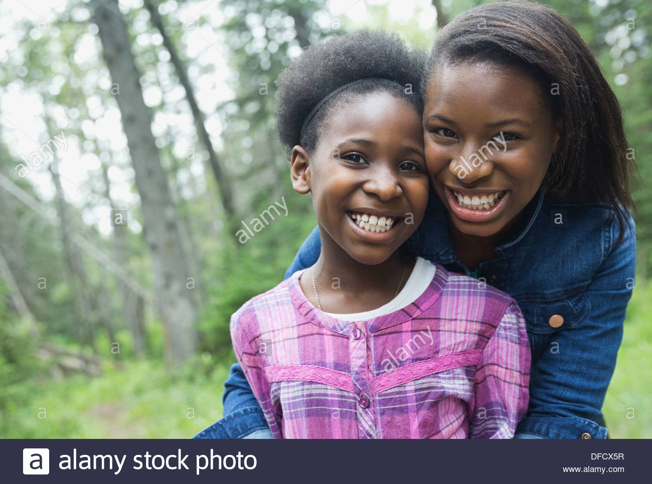 Portrait two happy sisters hugging hi-res stock photography and images ...