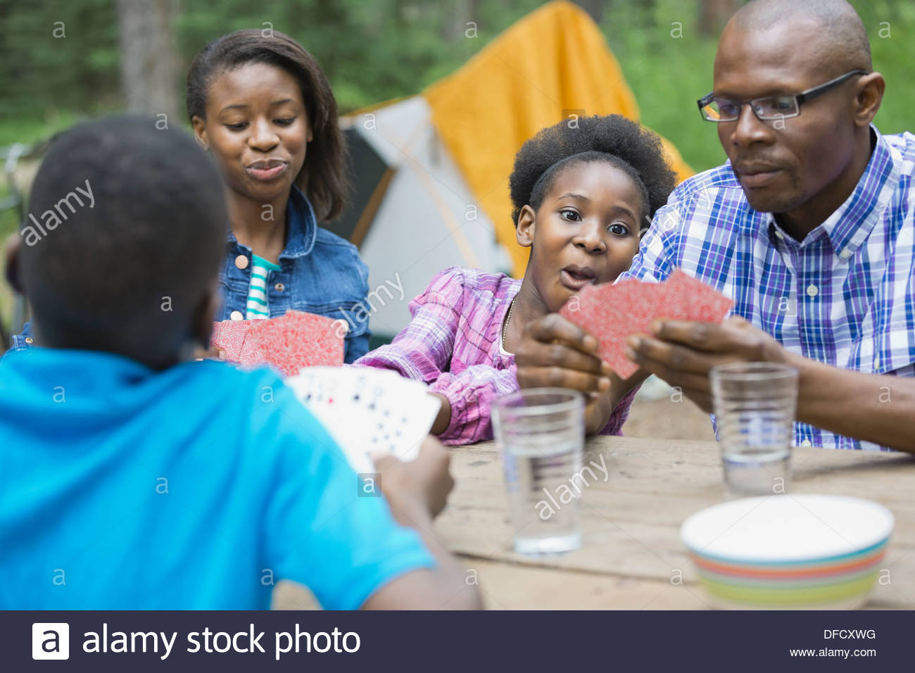 Family playing cards campsite hi-res stock photography and images - Alamy