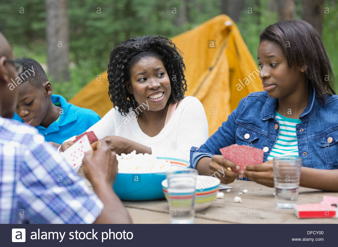 Family playing cards campsite hi-res stock photography and images - Alamy