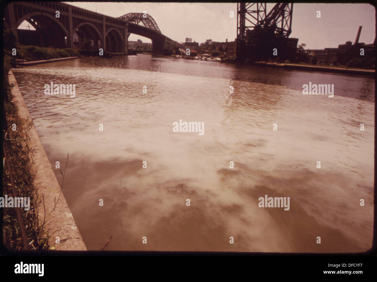 Discolored water in the Cuyahoga River, caused by sewage discharge from ...