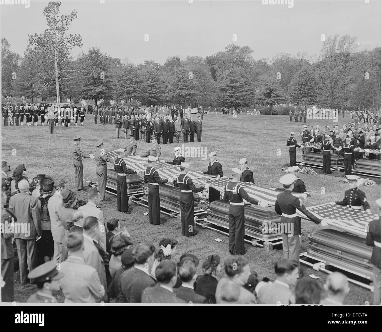 President Harry S. Truman is seen from a distance attending the burial ...