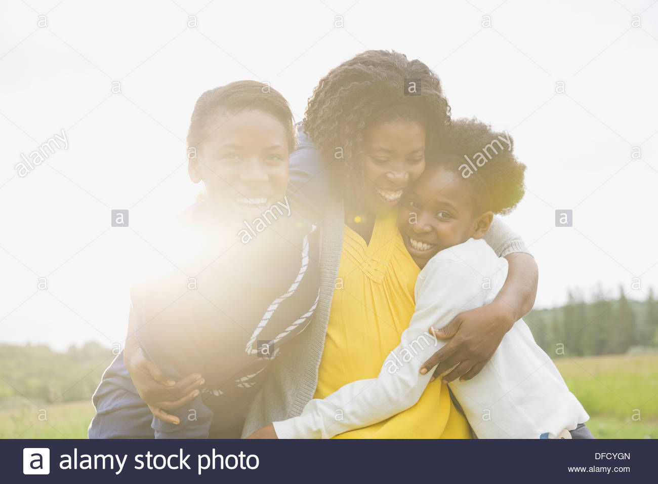Parent and children hugging outside hi-res stock photography and images - Alamy