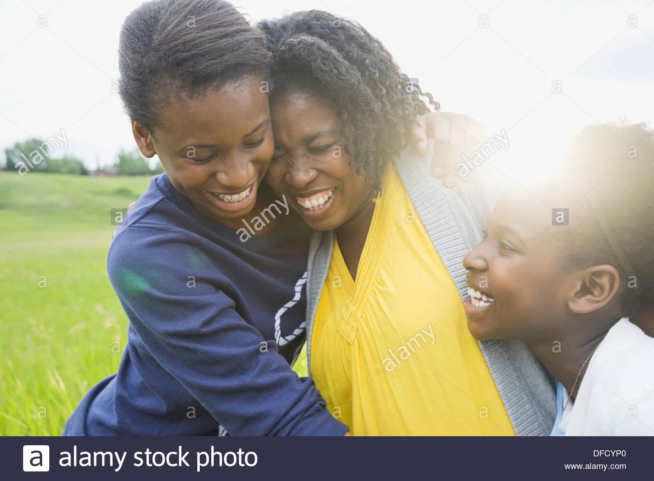 Parent and children hugging outside hi-res stock photography and images - Alamy