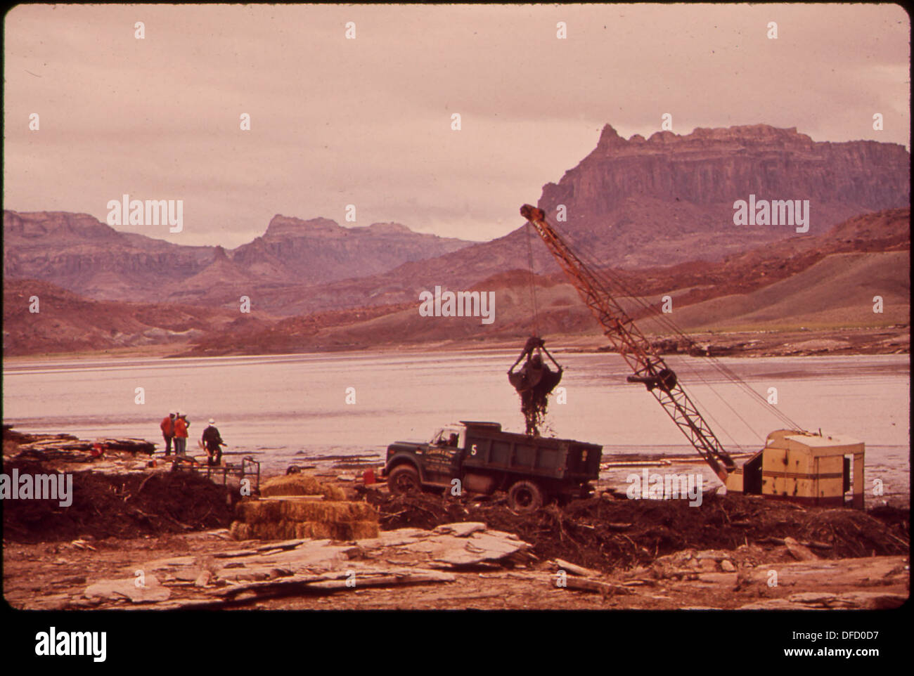 This photograph shows the use of a dragline basket and claim shell ...