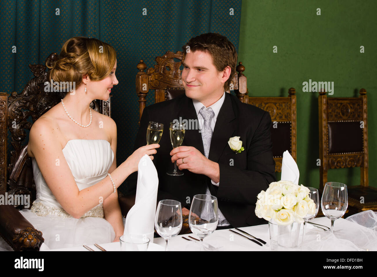 Toasting bride and groom celebrating at a wedding Stock Photo - Alamy