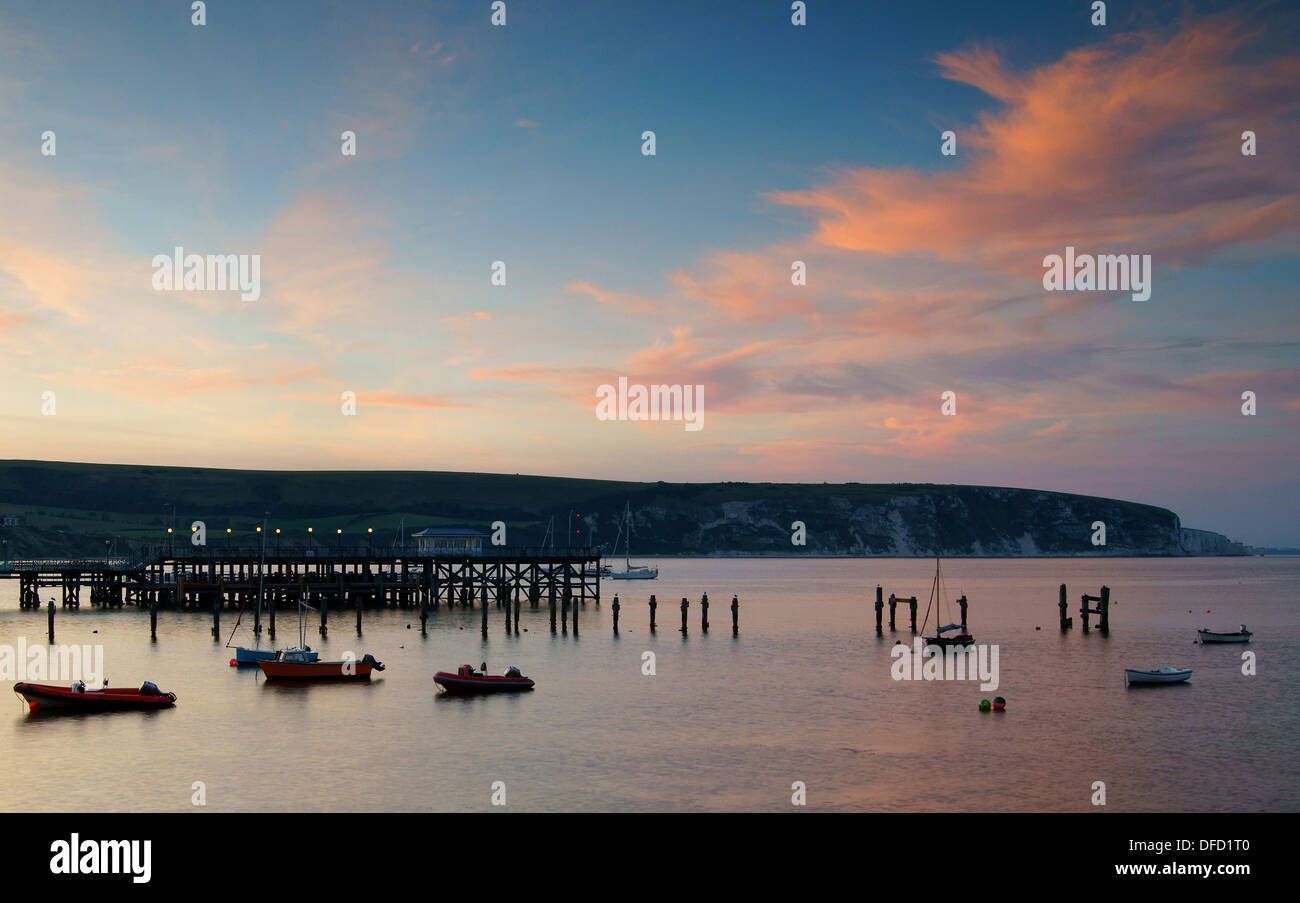 UK,Dorset,Swanage,Sunset over Ballard Point, Old & New Pier in Swanage ...