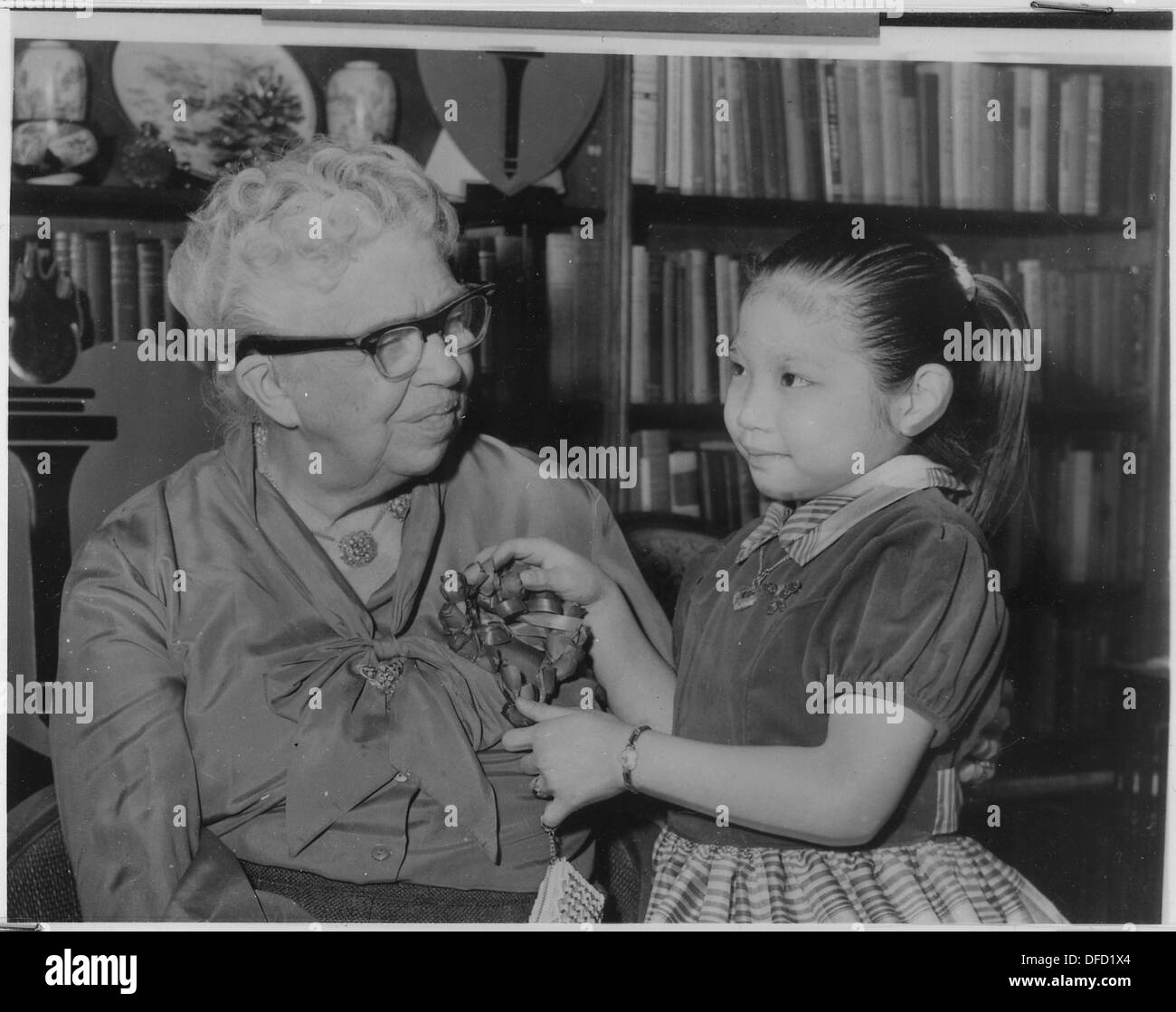 This photograph shows Eleanor Roosevelt with a child from the Heart ...