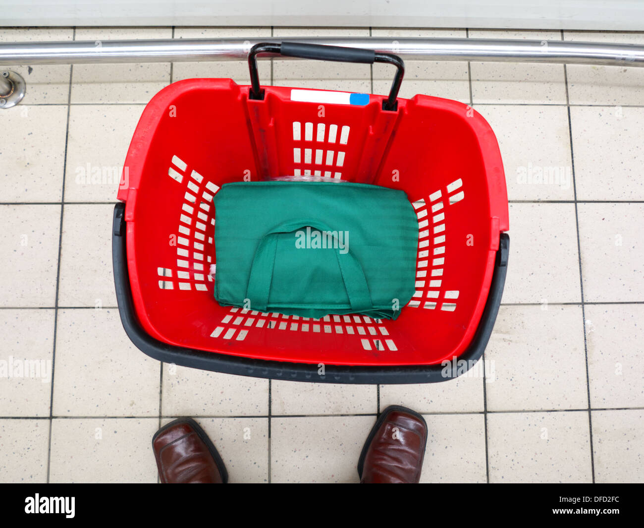 view of a red empty shopping basket at supermarket Stock Photo - Alamy