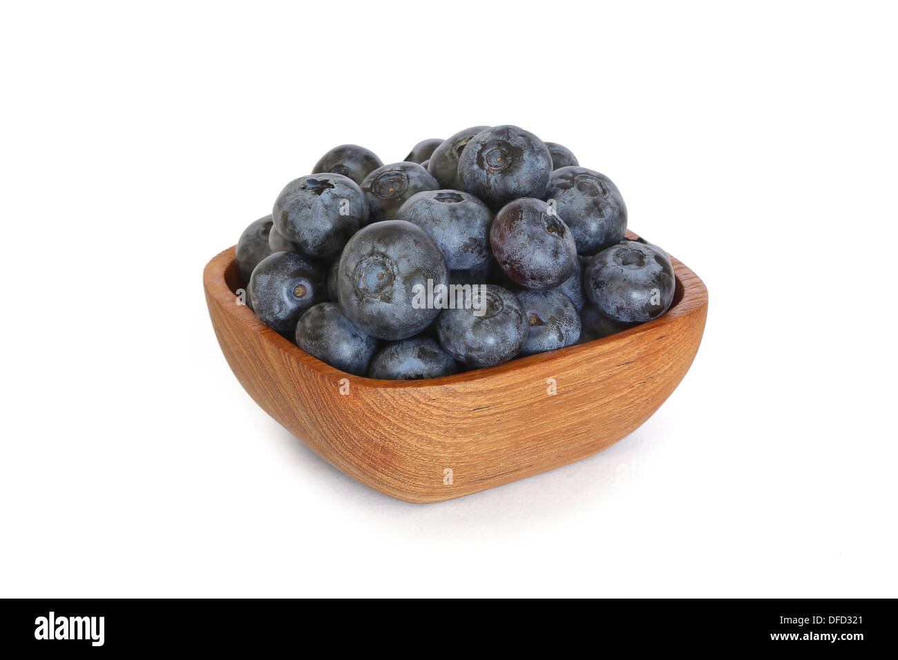 Blueberry in wood bowl isolated on white background Stock Photo - Alamy