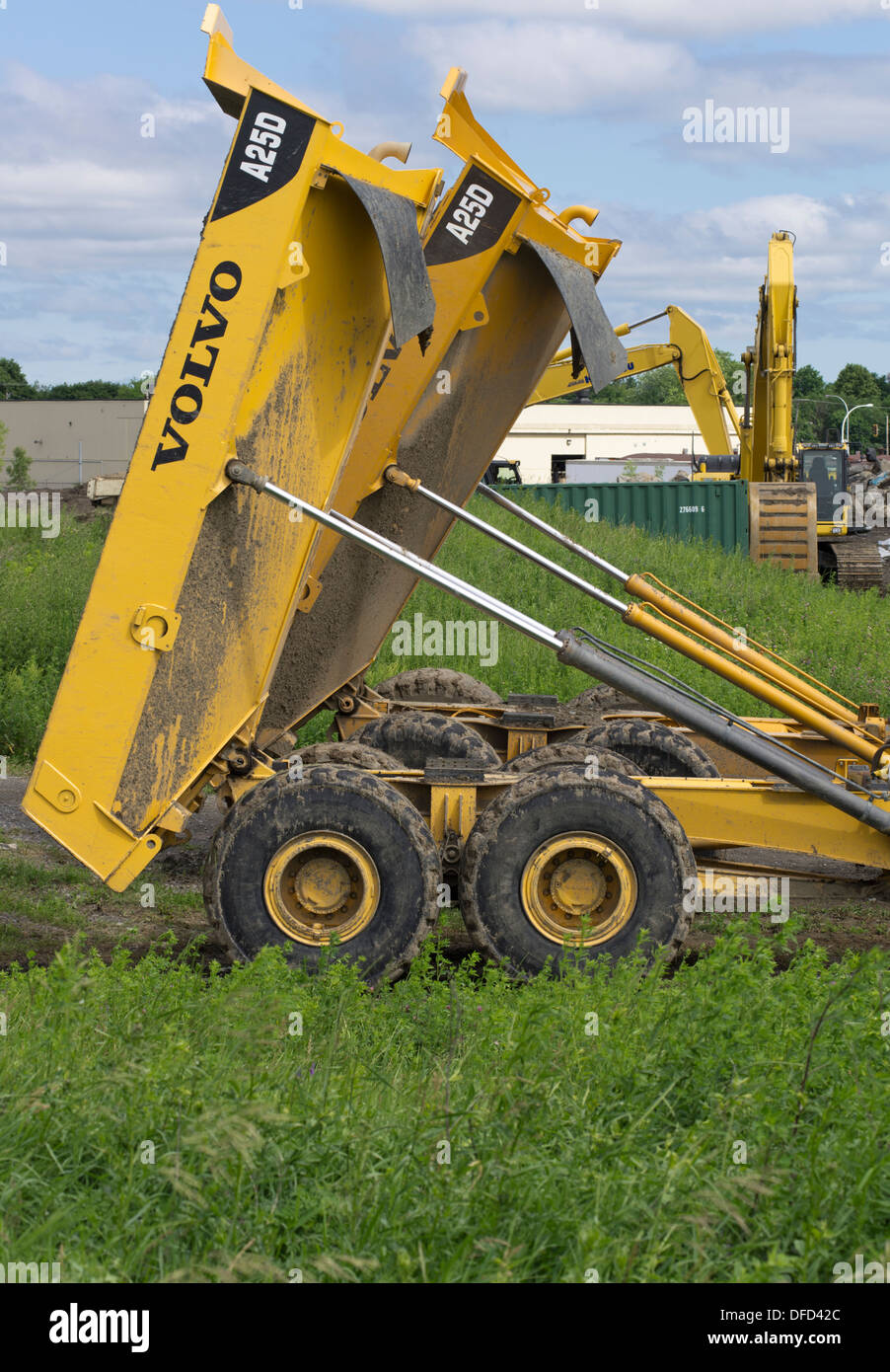 Two yellow volvo trucks lifted hi-res stock photography and images - Alamy