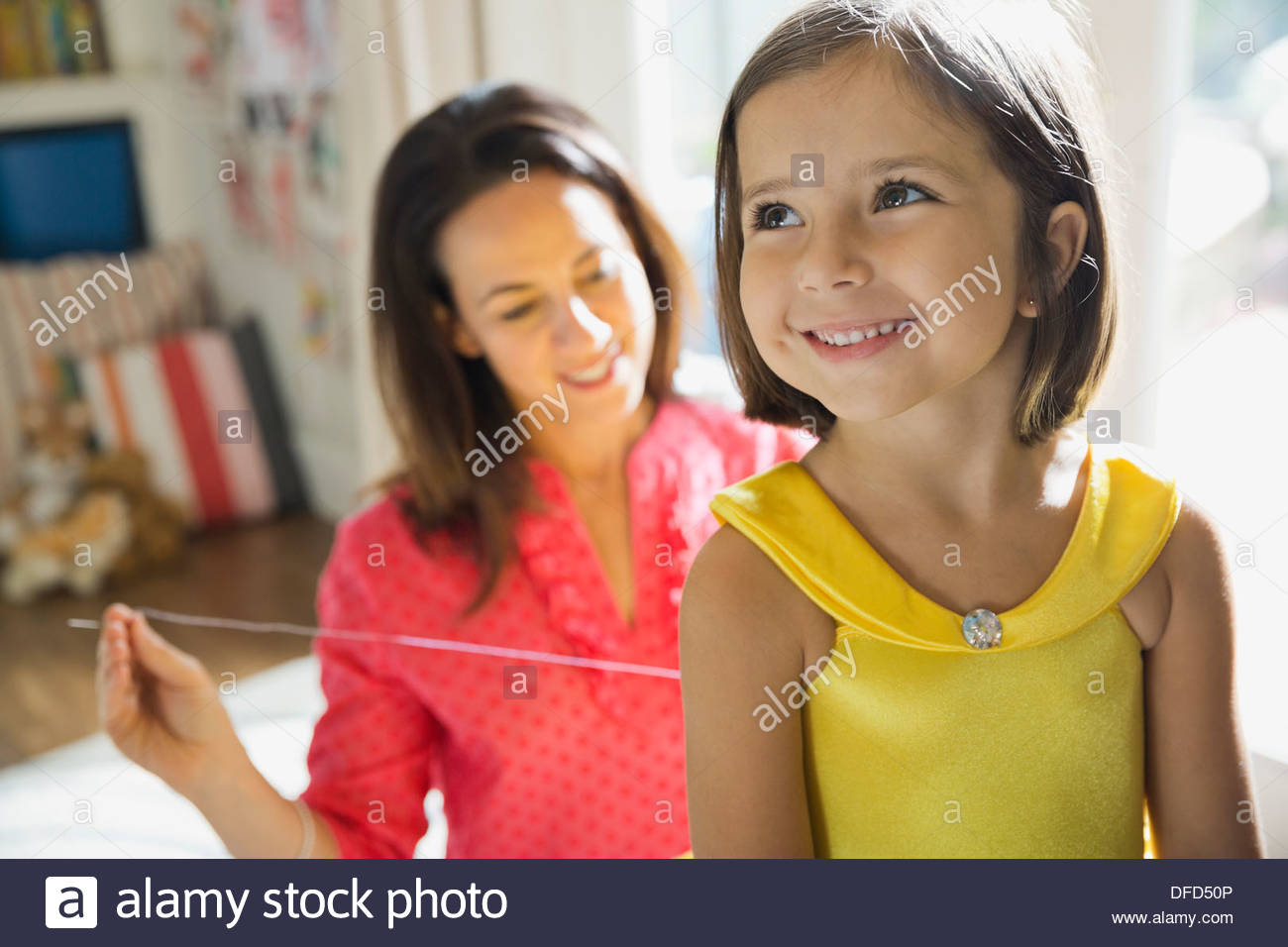 Girls together sewing hi-res stock photography and images - Alamy