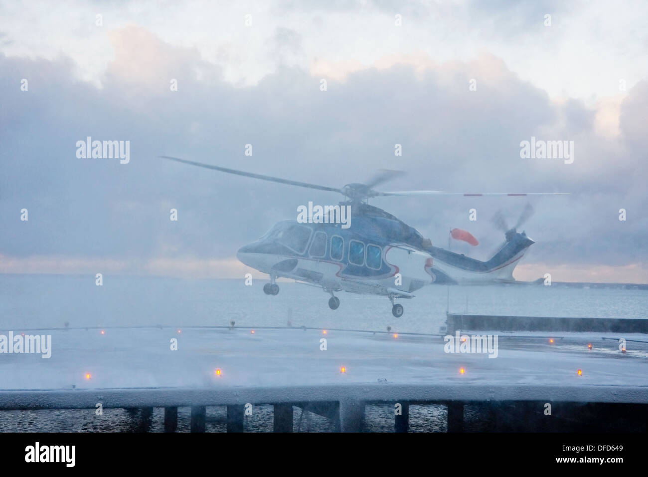 Helicopter in snow storm Stock Photo - Alamy