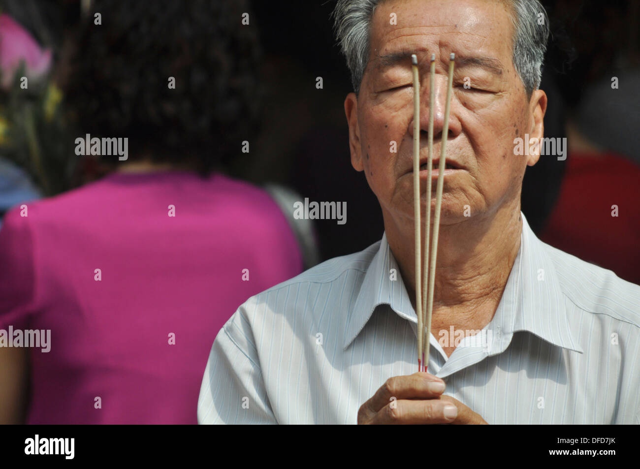 Chinese man praying at goddess mercy hi-res stock photography and ...