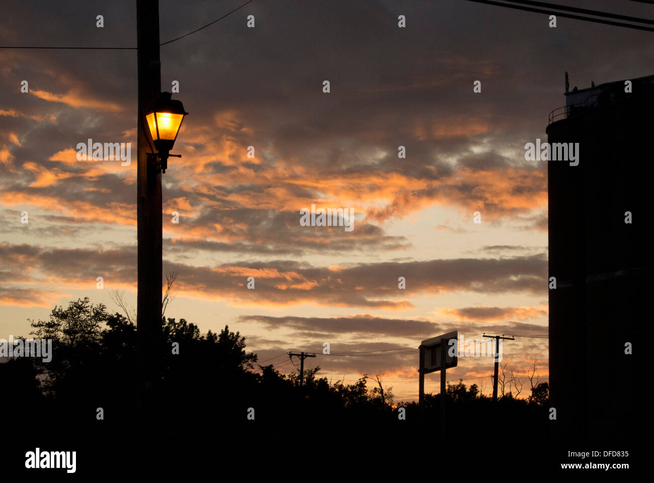 Dramatic sunset with street light Stock Photo - Alamy