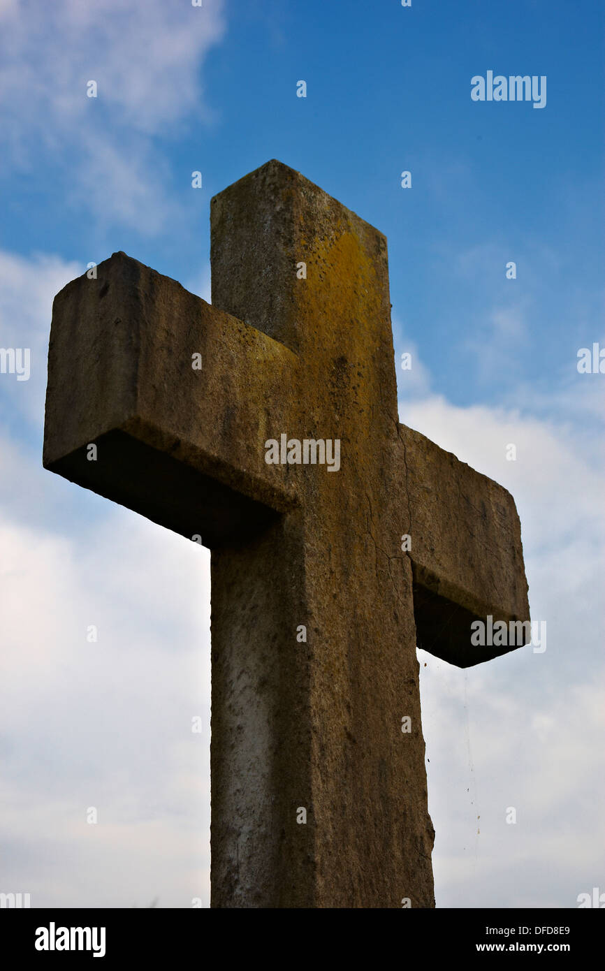 Graveyard cross against blue sky angled view Stock Photo - Alamy