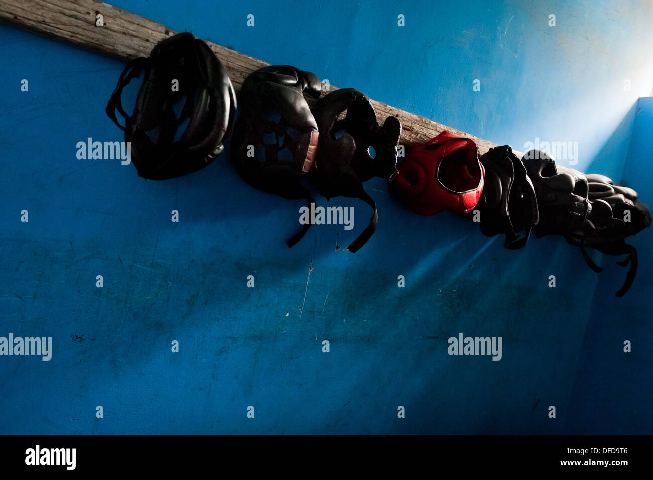 Boxing headgear hung on the rack in the boxing change room in Lima ...