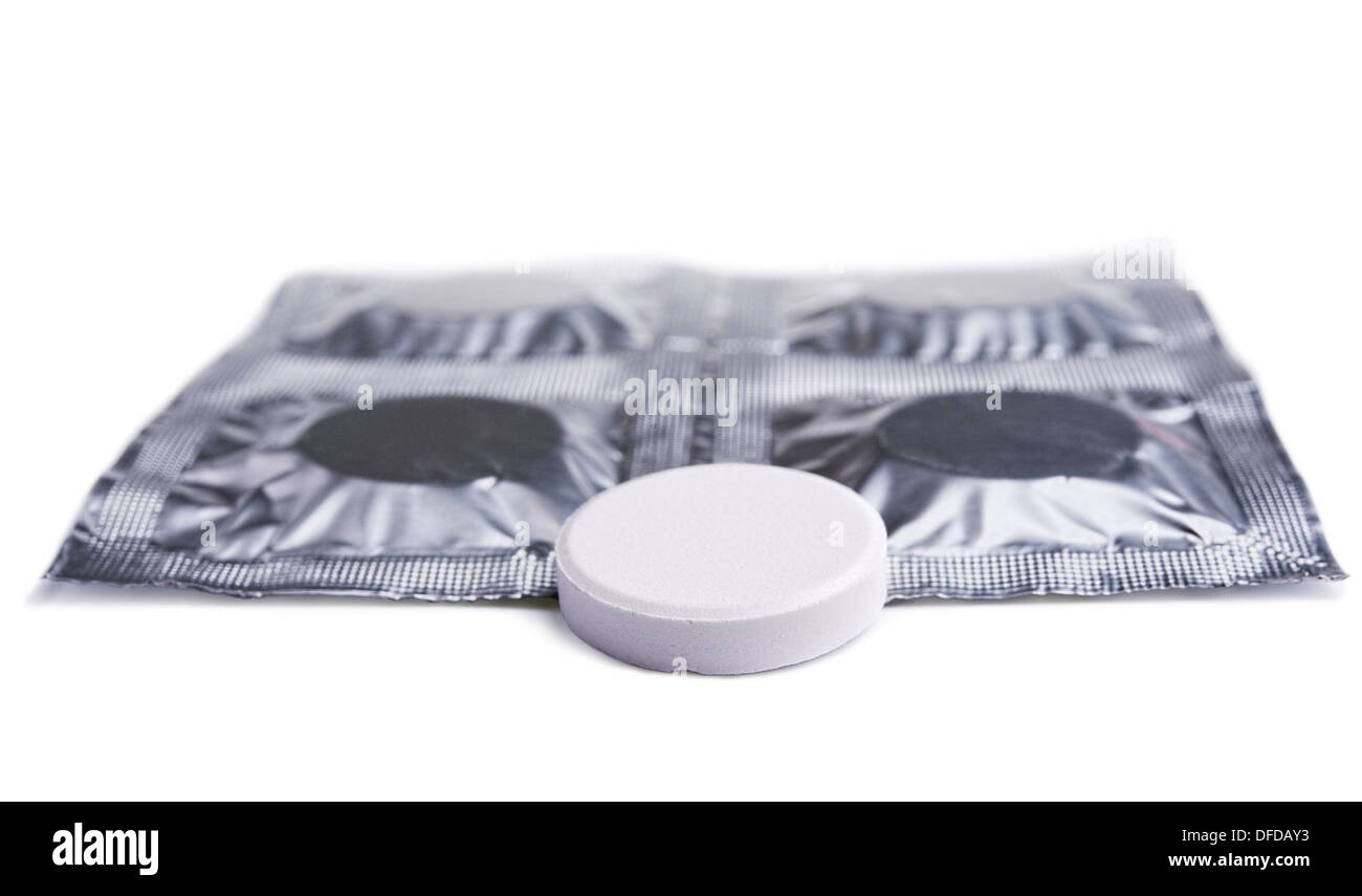 single white tablet with pack on white background Stock Photo - Alamy
