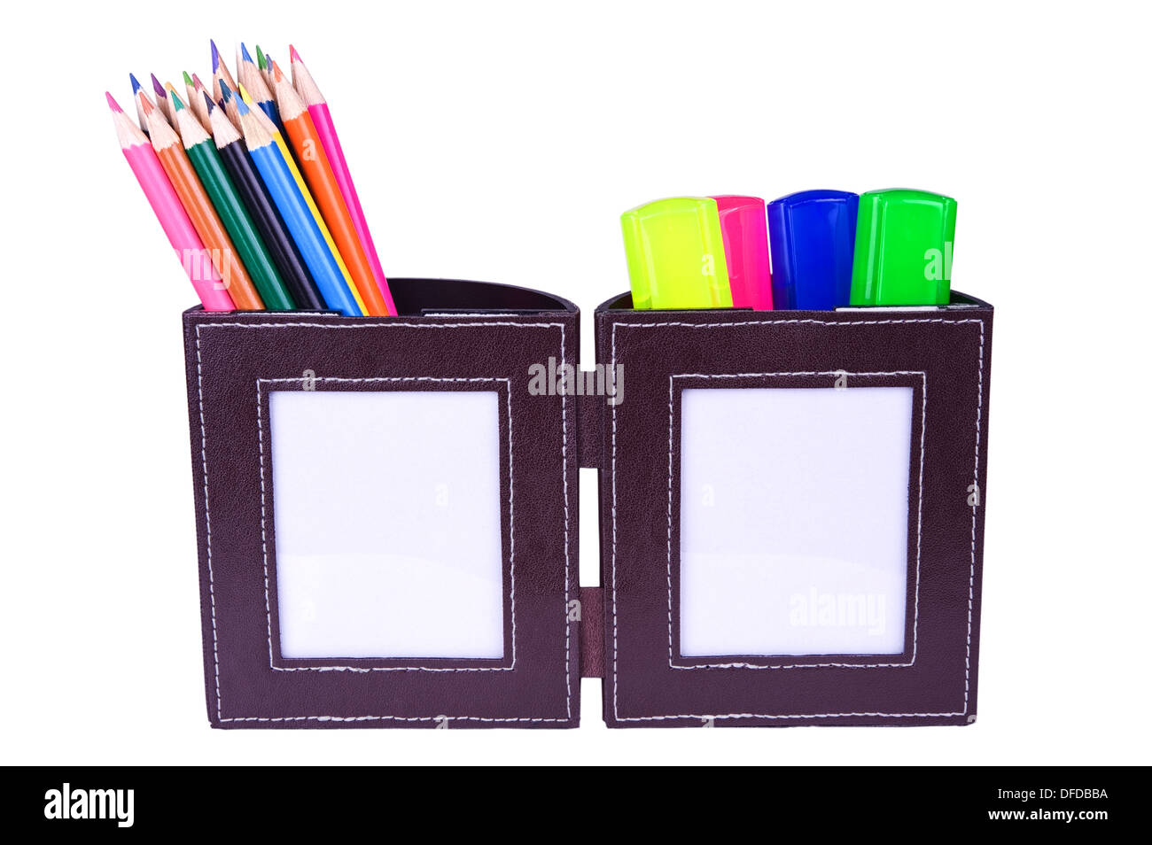 Various colour pencils and markers in a cup isolated on white ...