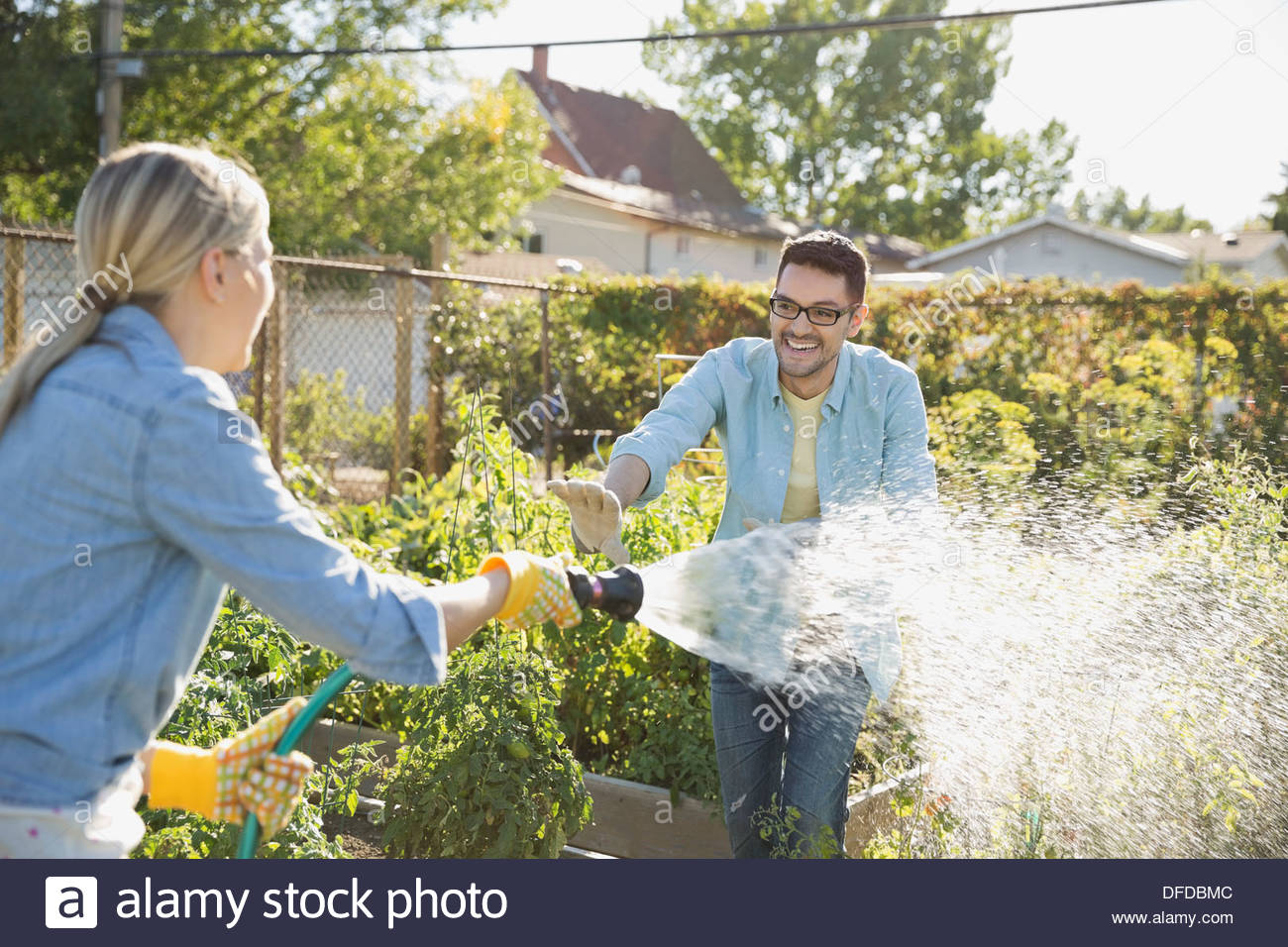 Spraying up with hose hi-res stock photography and images - Alamy