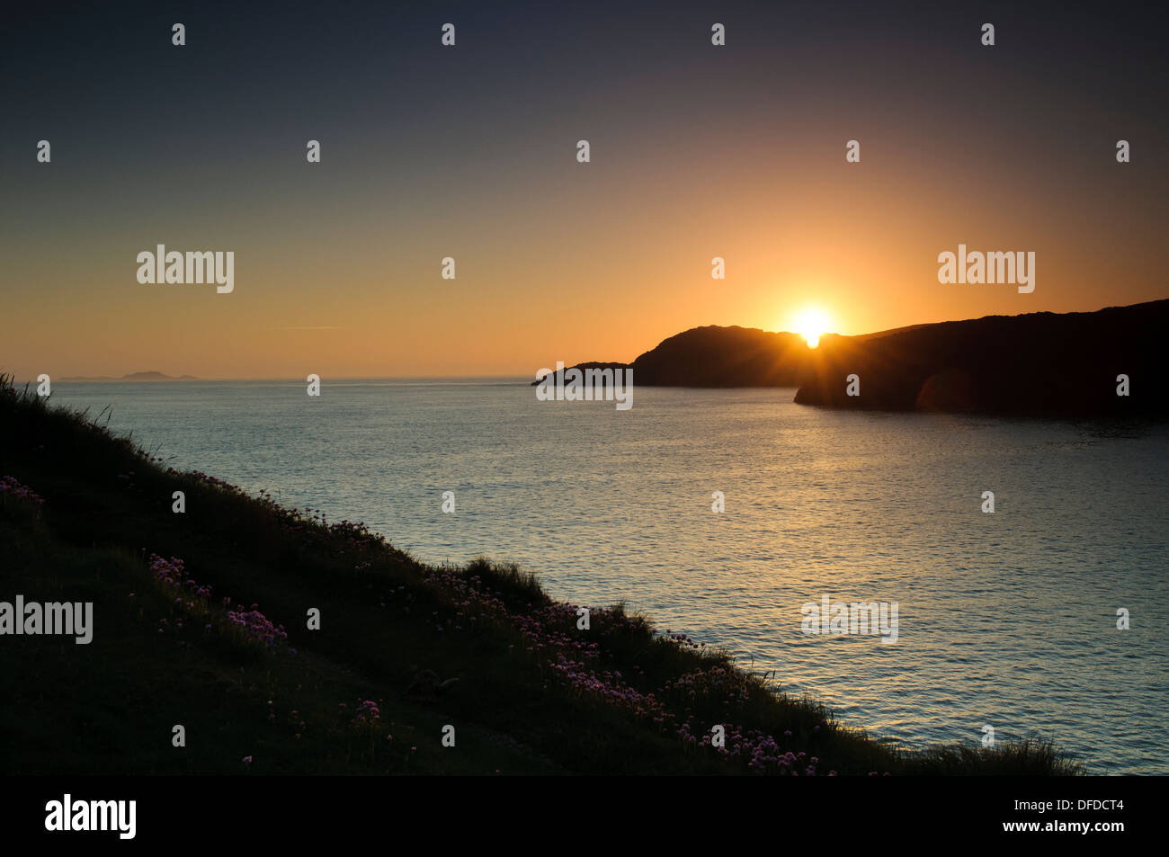 A sunset on the Irish Sea, seen from the cliffs at St David's Head in ...
