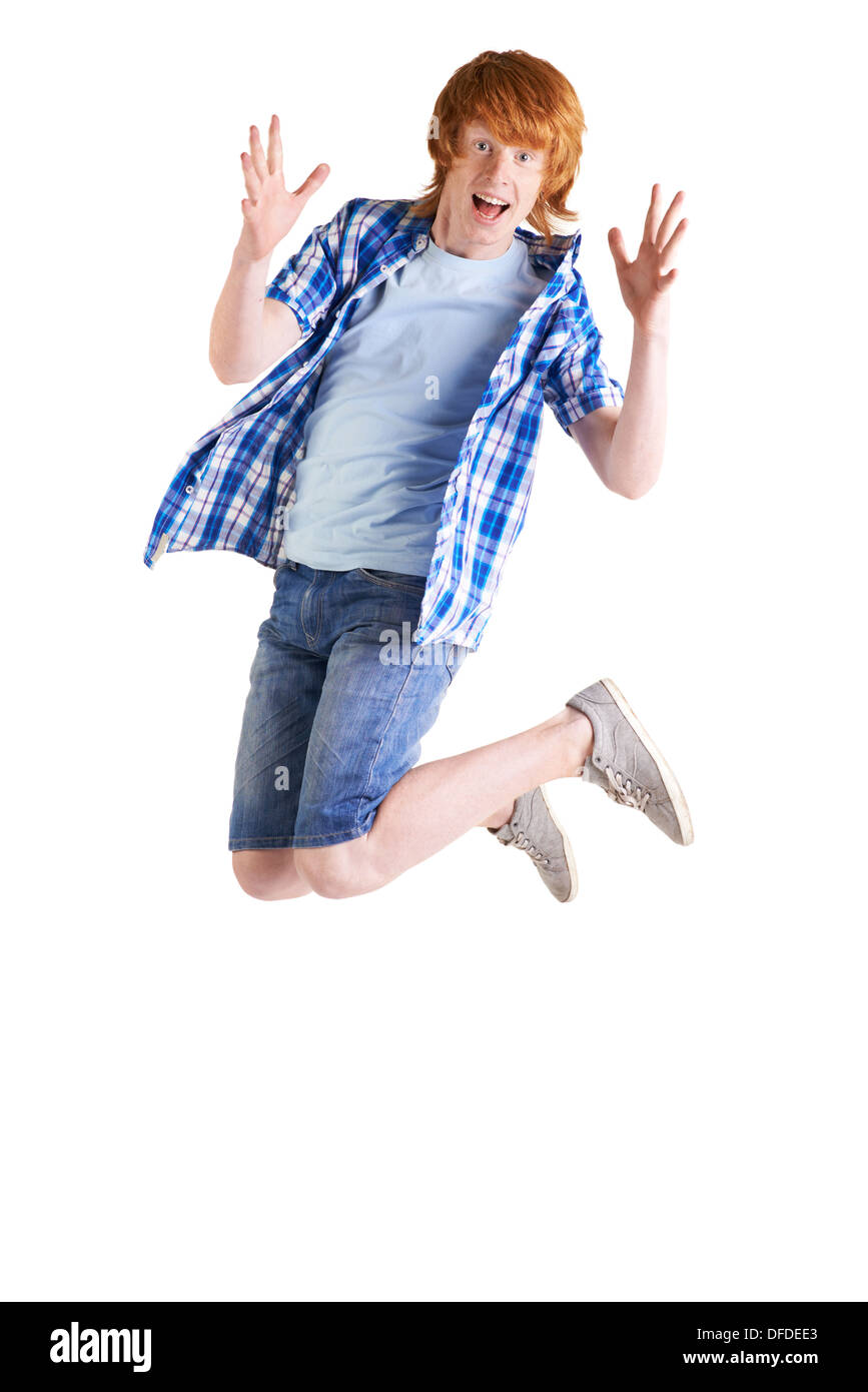 Portrait of attractive guy in jump over white background Stock Photo ...