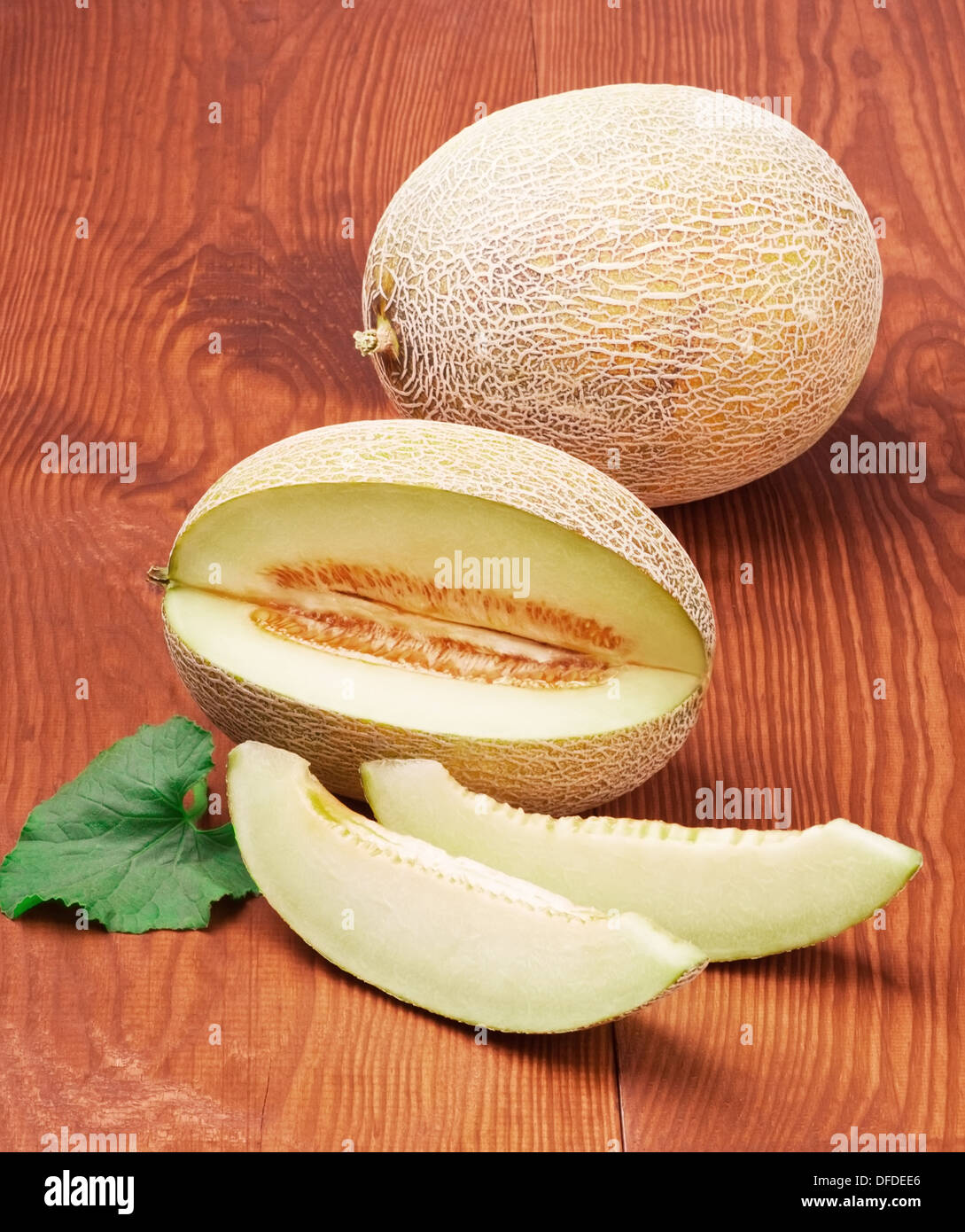 melon of yellow color and worn table Stock Photo - Alamy