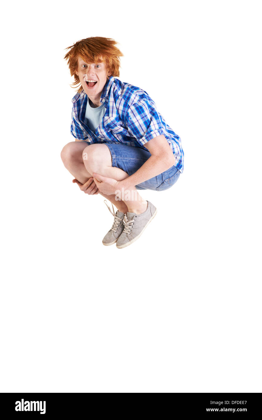 Portrait of attractive guy in jump over white background Stock Photo ...