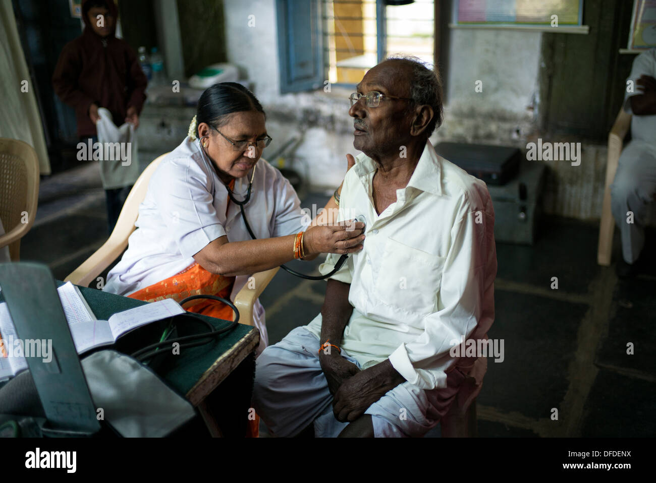 Sri Sathya Sai Baba mobile outreach hospital doctor treating a patient ...