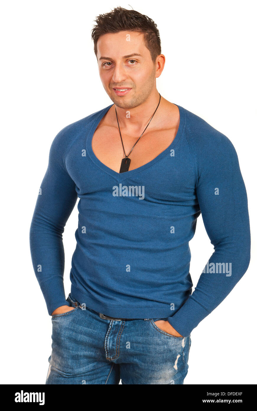 Muscular model man posing in blue shirt and jeans isolated on white ...