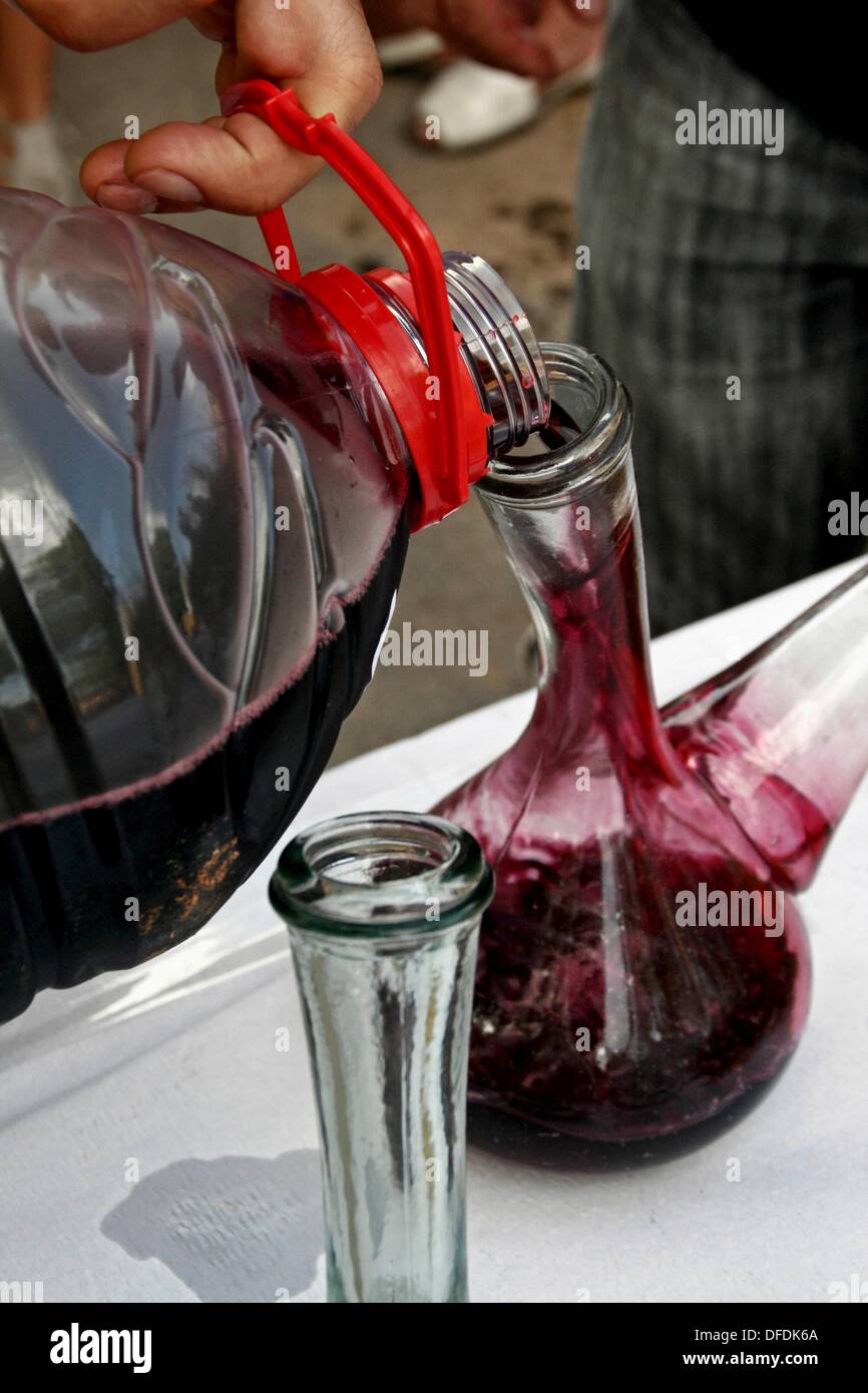 filling the jug of wine Stock Photo - Alamy