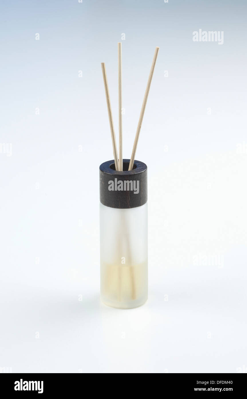 Scent bottle with aroma sticks on white background Stock Photo - Alamy