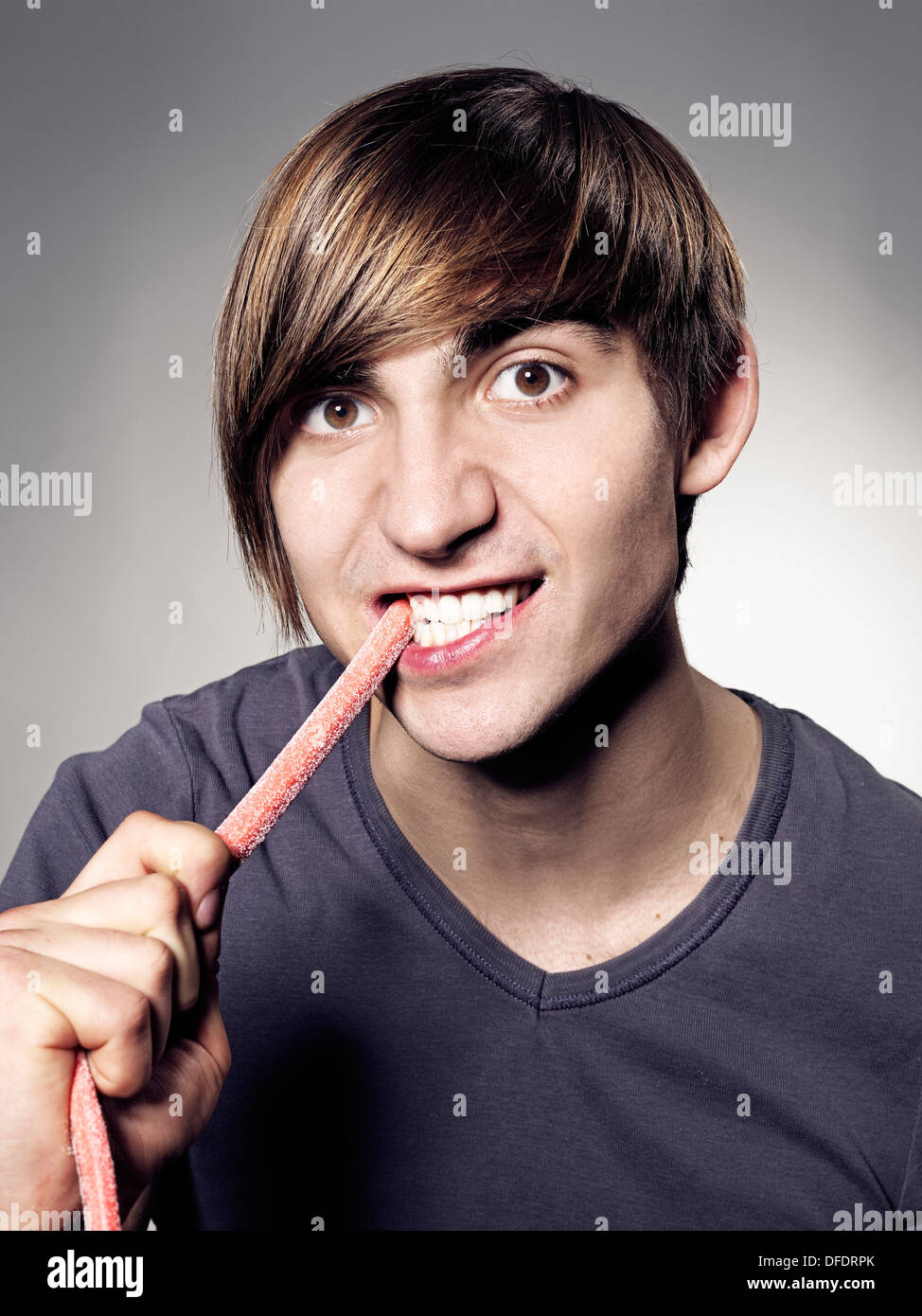 Man holding candy Cut Out Stock Images & Pictures - Alamy