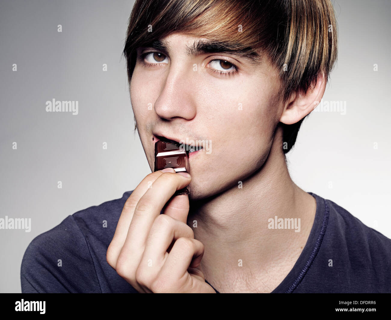 Man eating chocolate hi-res stock photography and images - Alamy