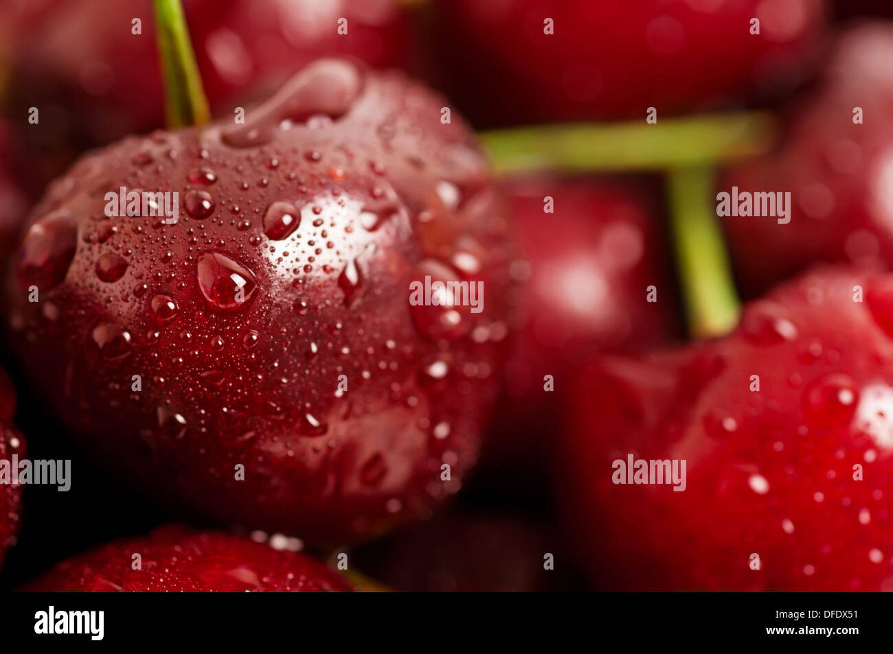 Sweet cherry background Stock Photo - Alamy