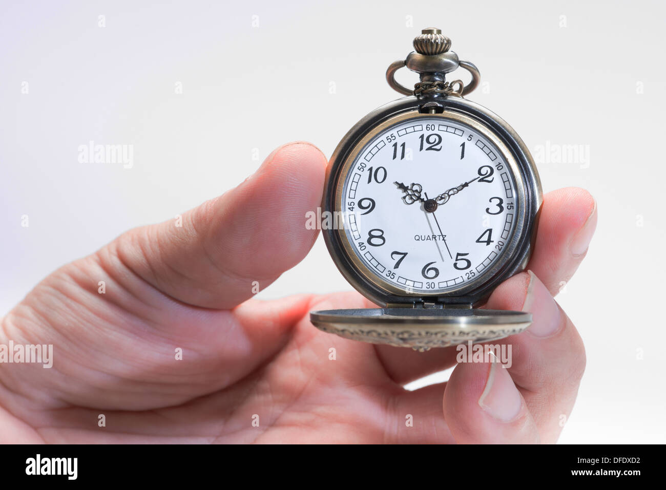 pocket watch in hand on the white background Stock Photo - Alamy