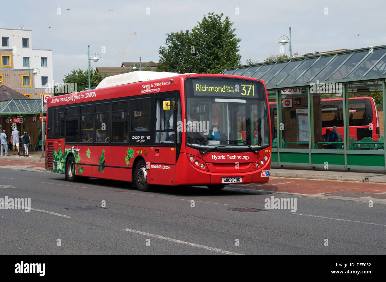 A hybrid single deck bus passes Kingston Bus station on route 371 to ...