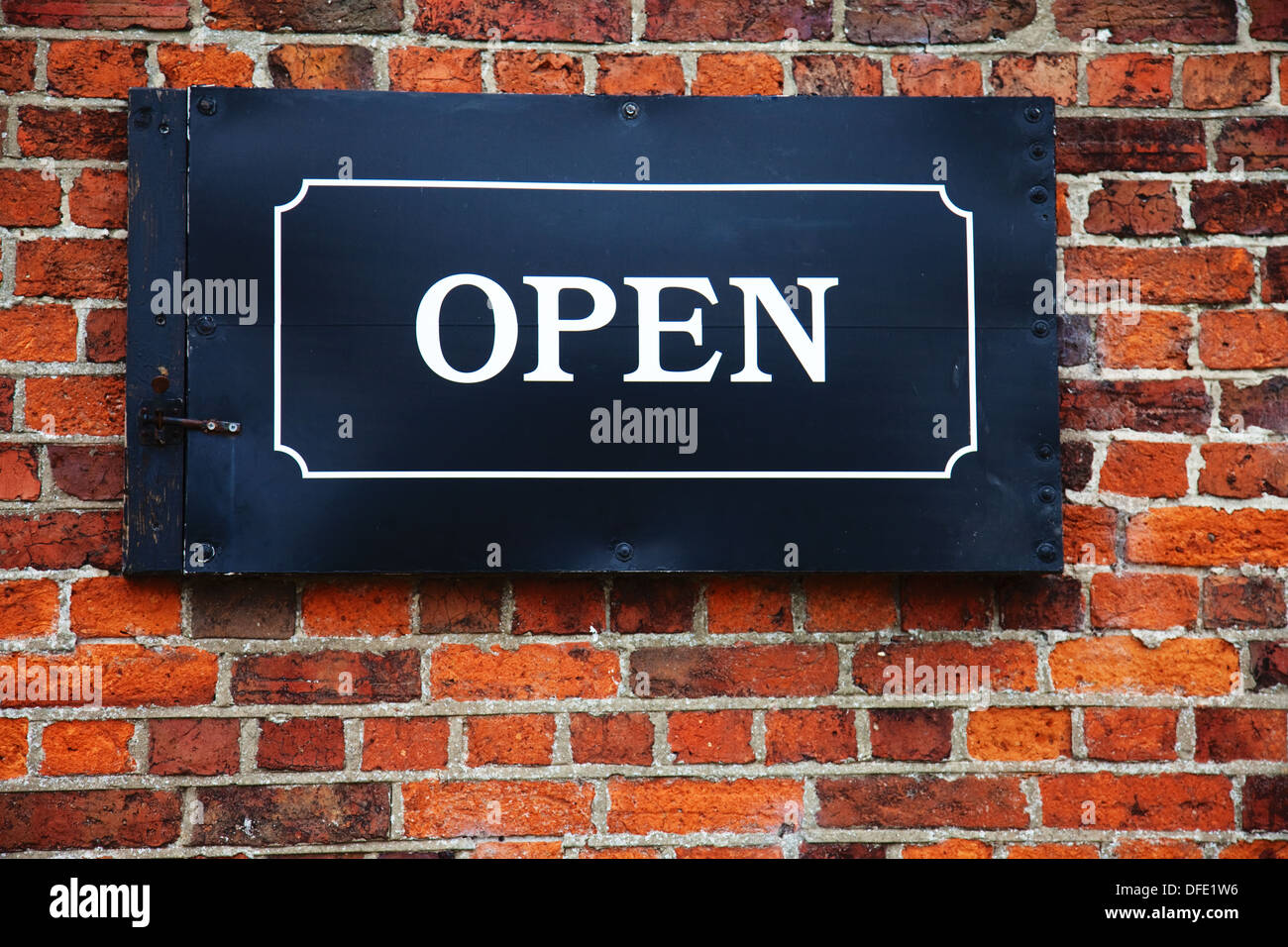 Old metal sign on a brick wall Stock Photo - Alamy