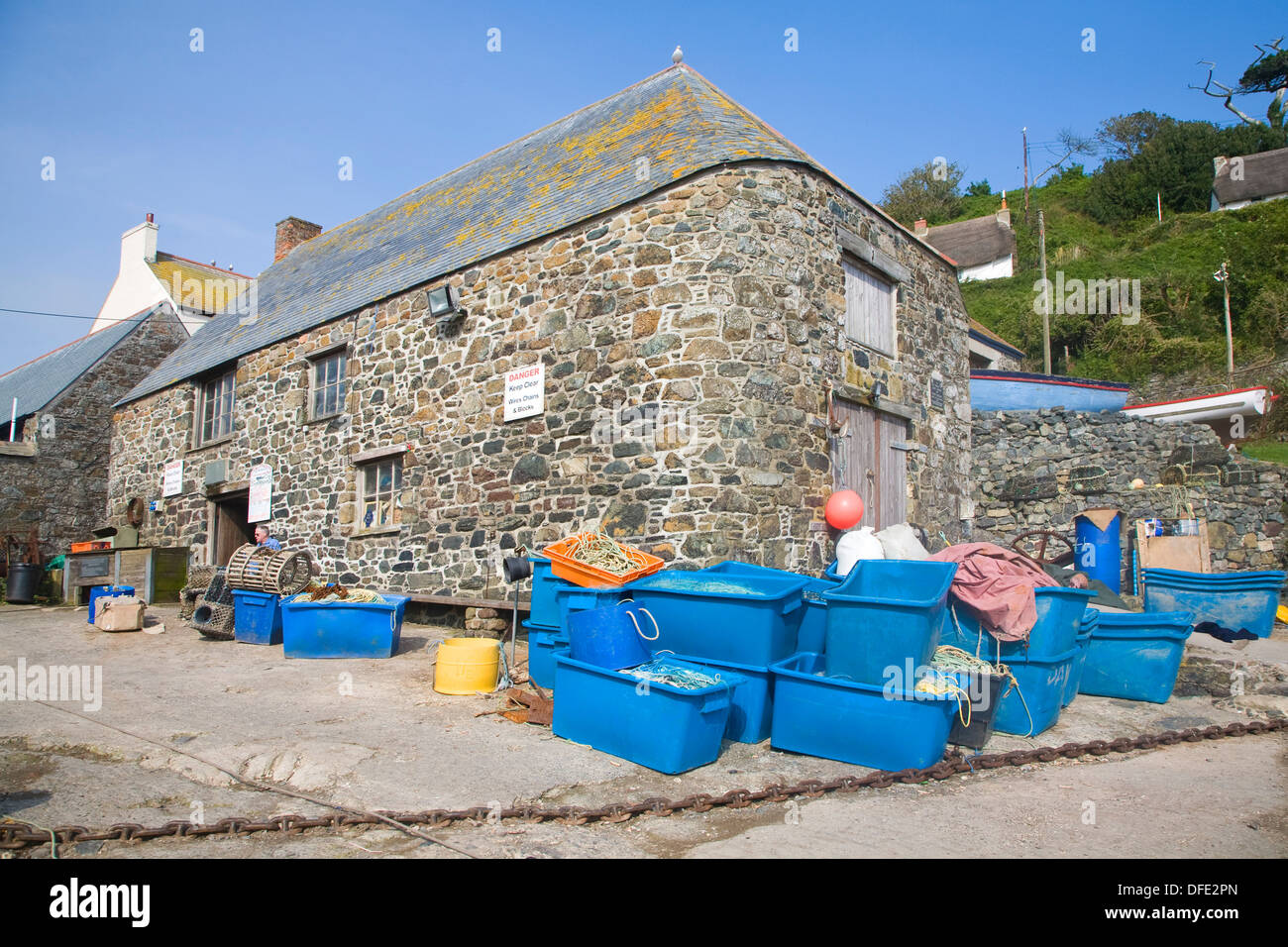 Fishing equipment and buildings in the fishing village of Cadgwith Cove ...